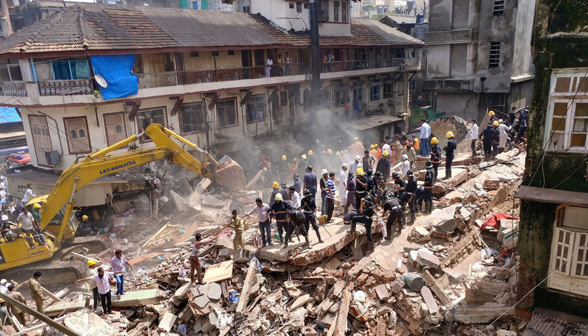 70 trapped in India’s building collapse