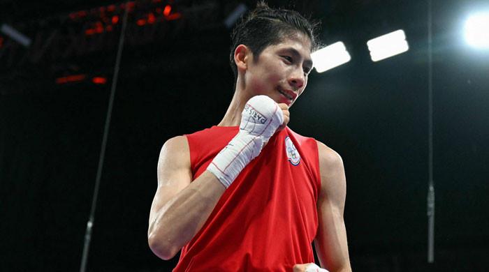 Taiwanese boxer in Olympics gender row wins to guarantee medal