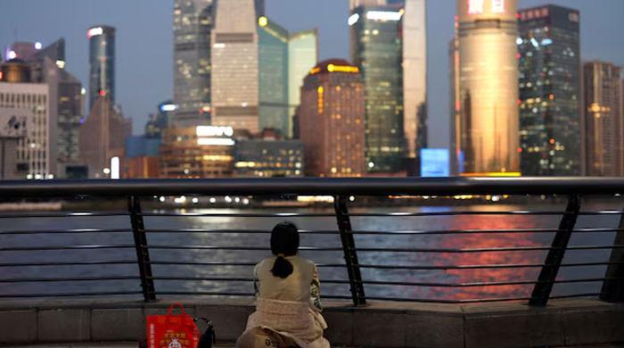 China urges more aid for people in need as economic woes persist