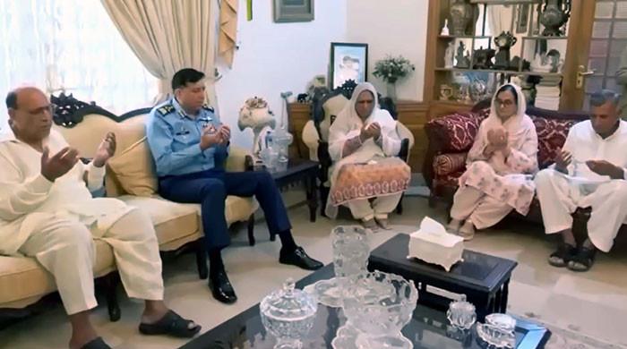 PAF chief visits family of Shaheed Squadron Leader Usman